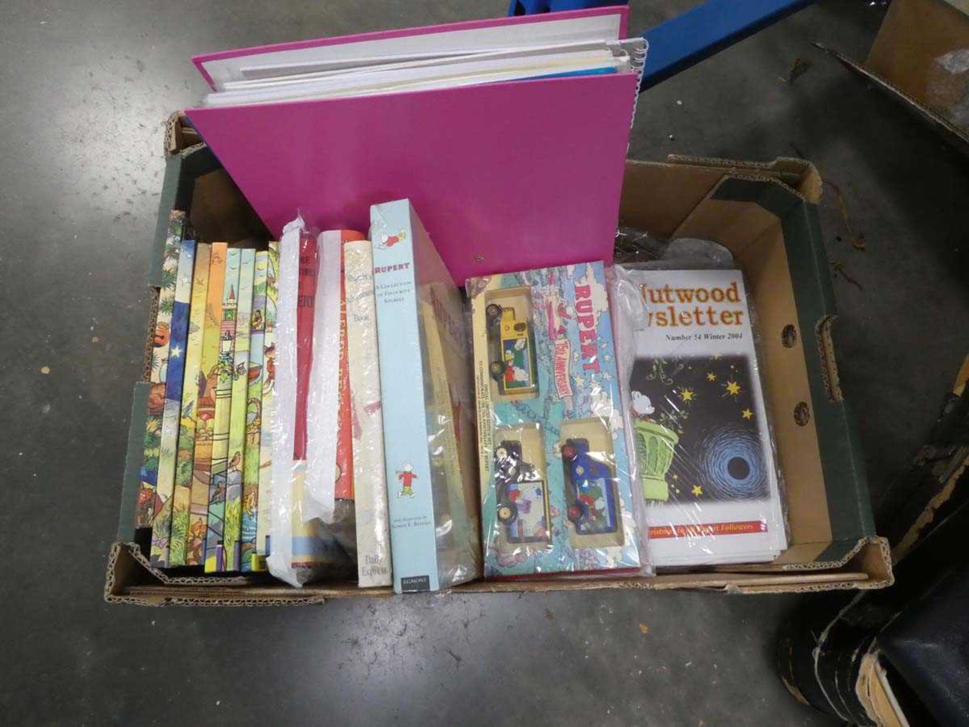 Box containing Rupert the Bear annuals, Rupert 75th anniversary car set ...