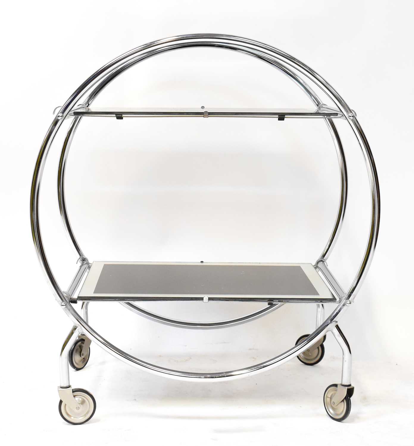 An Art Deco chrome and glass tea trolley, with circular supports and ...