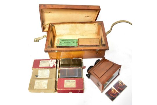 A Victorian mahogany magic lantern slide viewer and a quantity of boxed ...