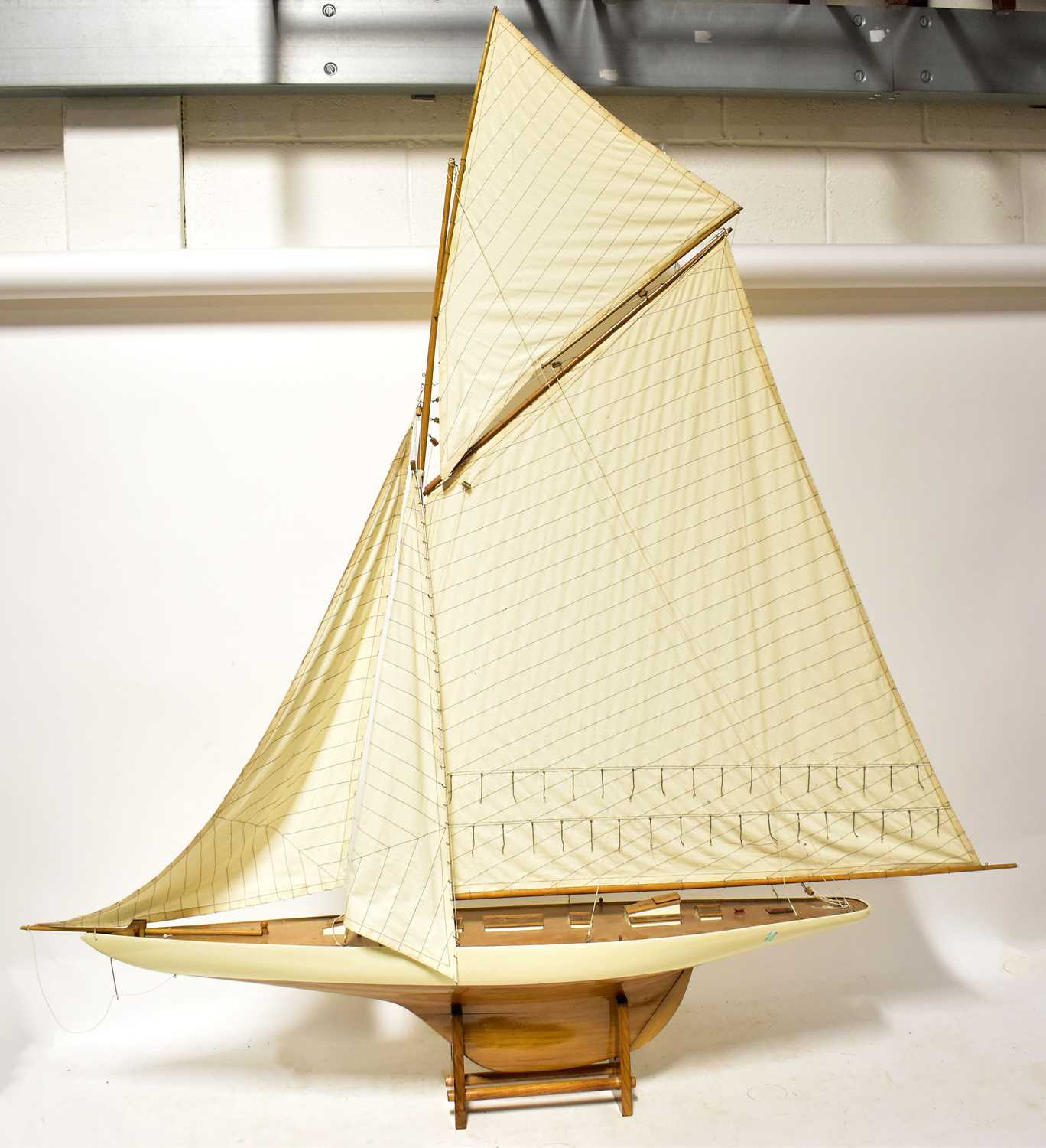 A large model yacht by Nauticalia of London, with three sails, cream ...