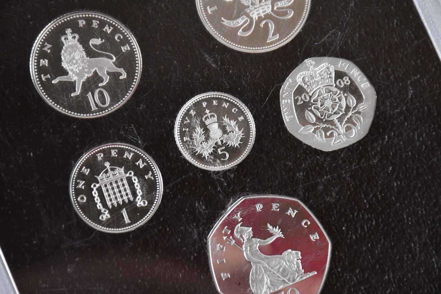 A Royal Mint 2008 platinum proof coin set comprising £1, 10p, 2p, 1p ...