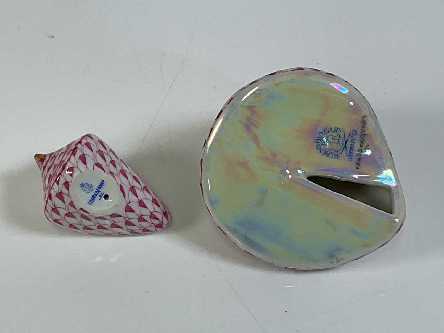 HEREND; two conch shells, both with printed and painted marks to base ...
