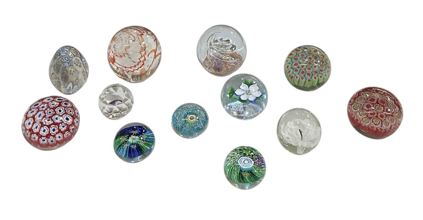 A collection of twelve assorted art glass paperweights including Murano ...