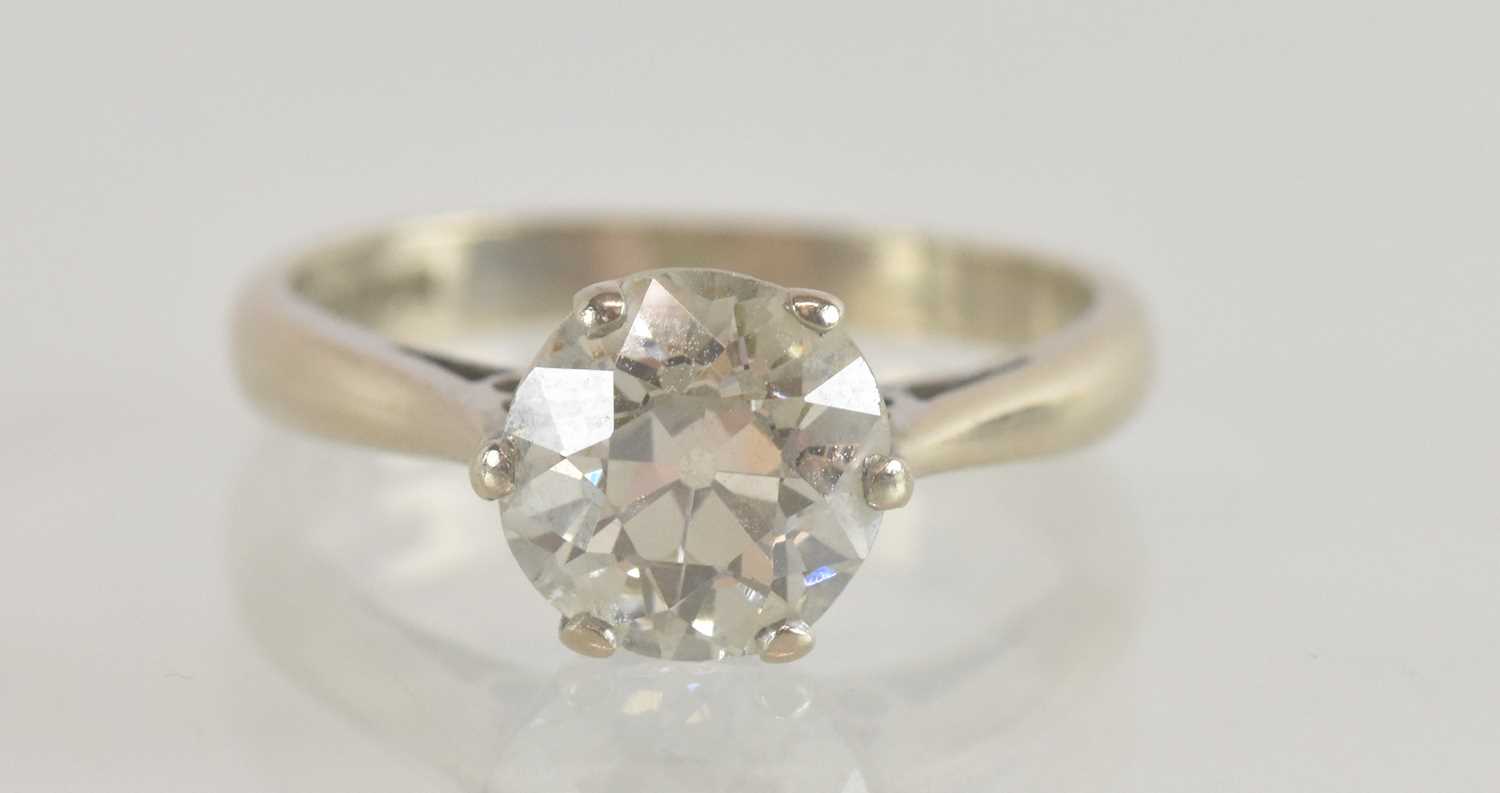 An 18ct white gold diamond solitaire ring, the single claw set ...