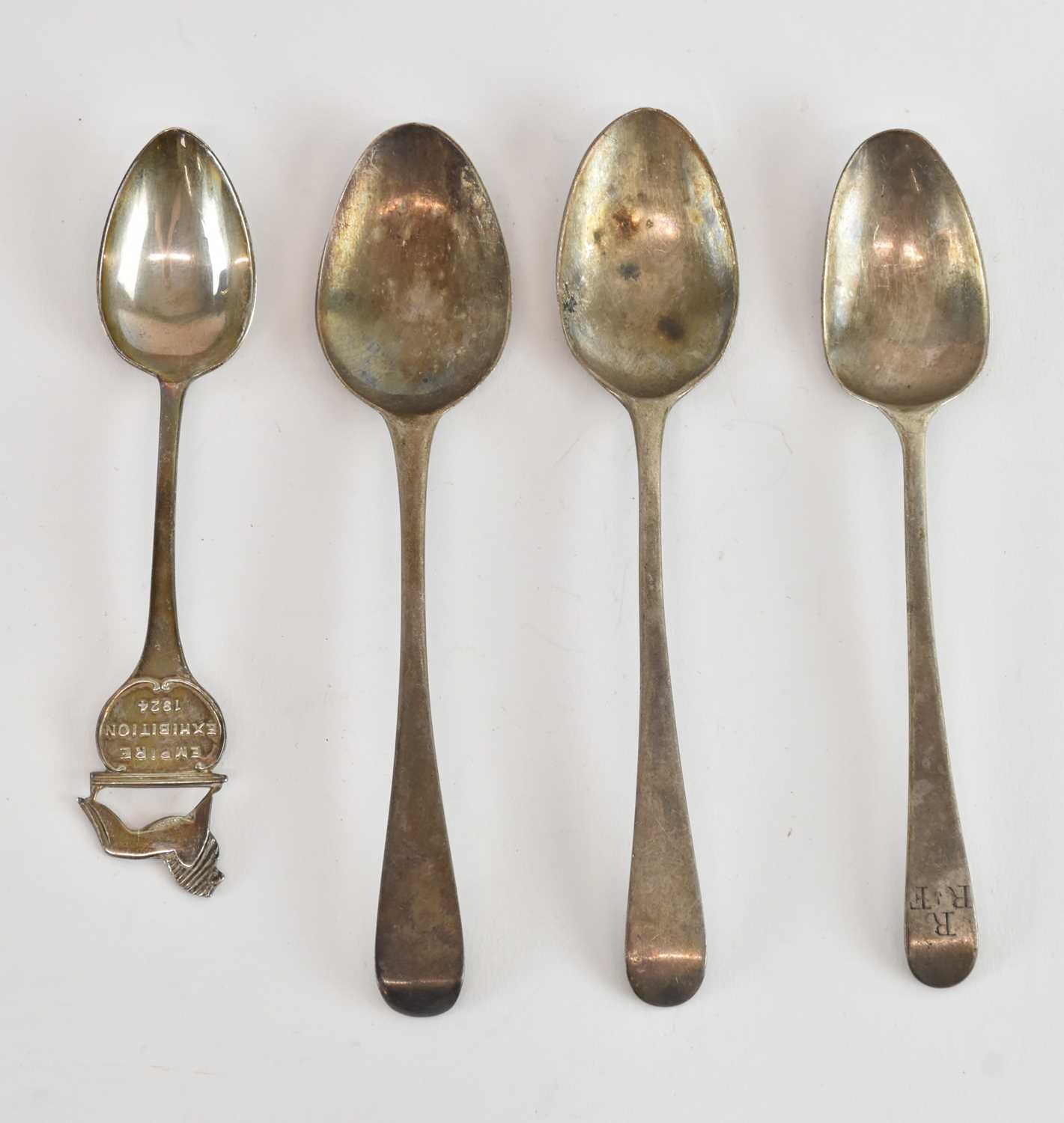 Four mixed hallmarked silver teaspoons, one example a souvenir of the ...