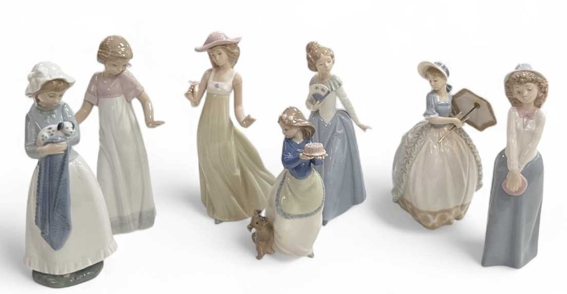 NAO; a collection of seven assorted porcelain figures of young ladies ...