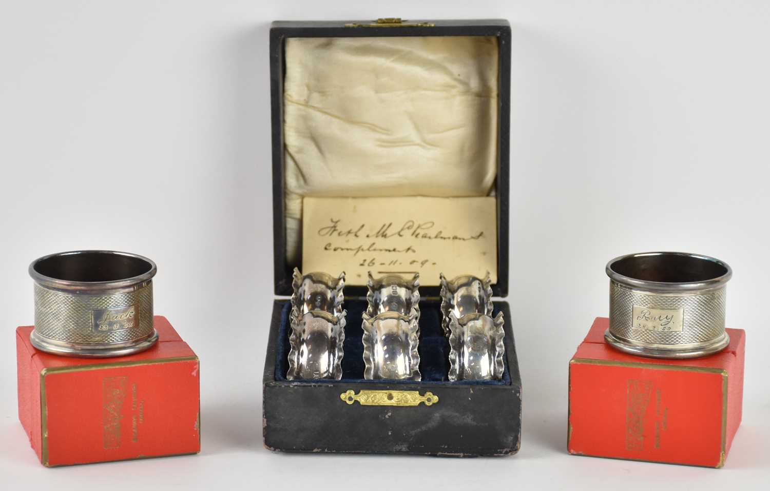 HENRY MORETON; a cased set of six Edward VII hallmarked silver napkin ...