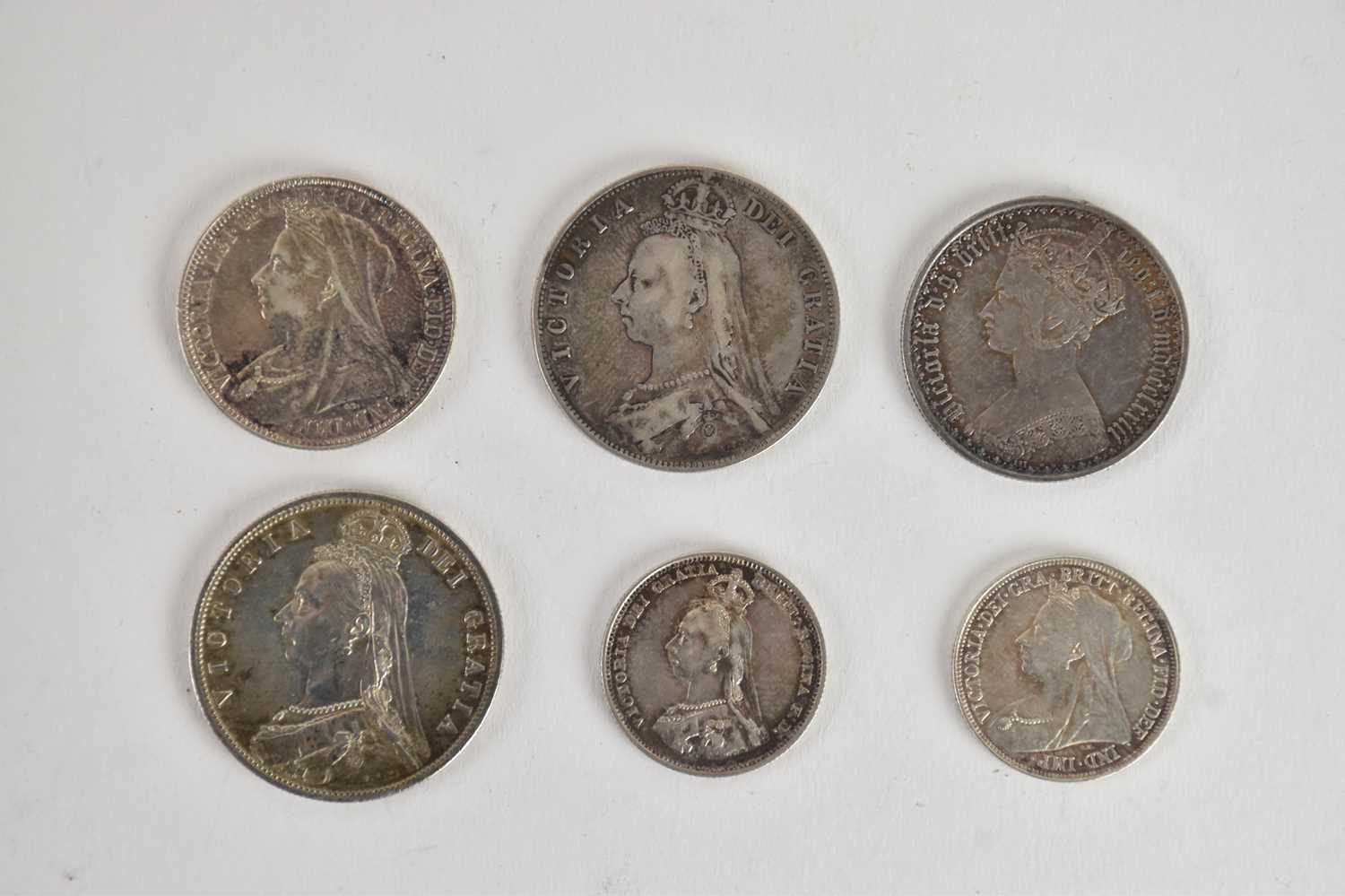Six Victoria silver coins comprising 1887 and 1890 half crowns, 1901 ...