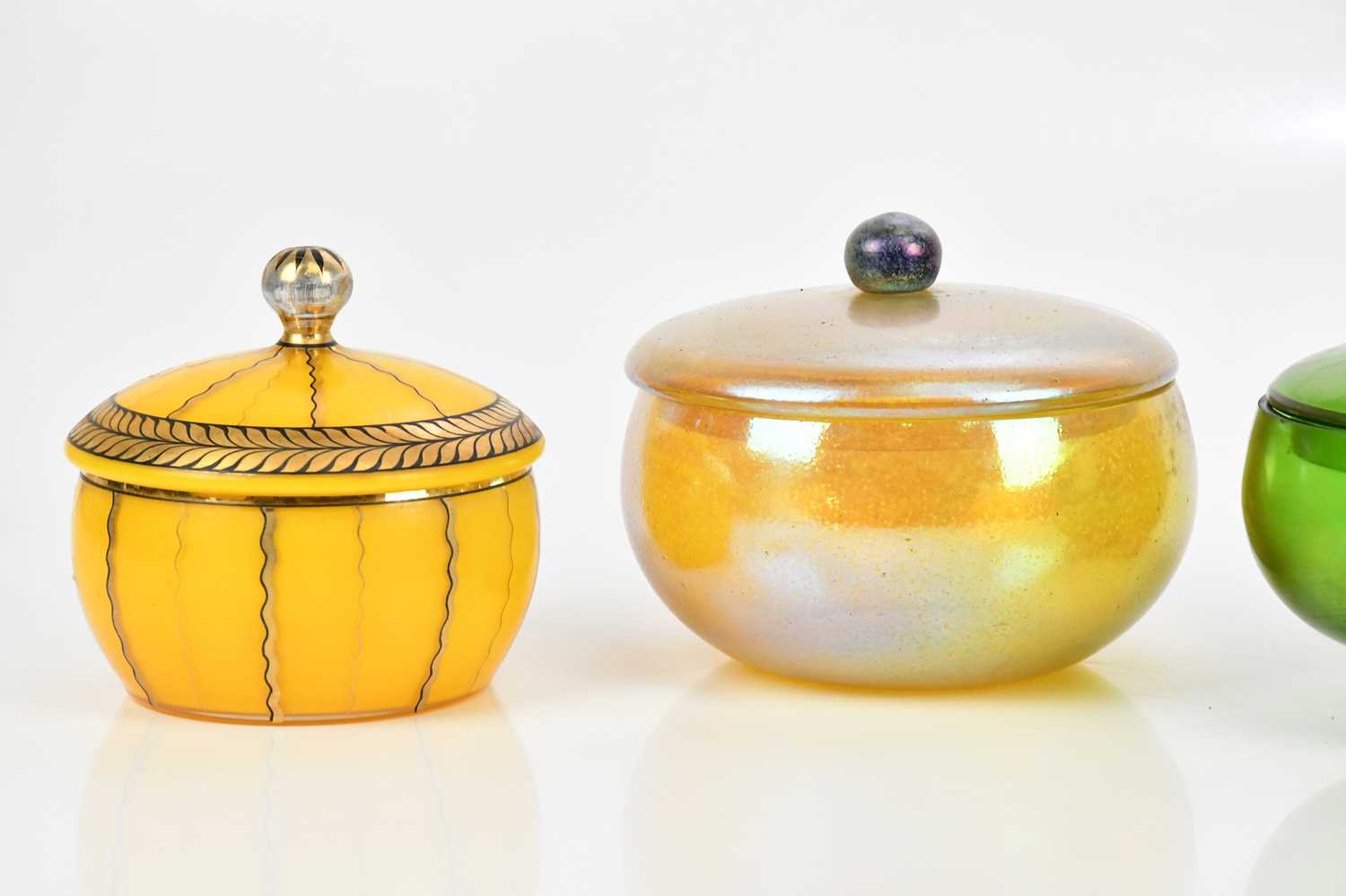 LOETZ; four art glass powder bowls and covers, including a Papillon ...
