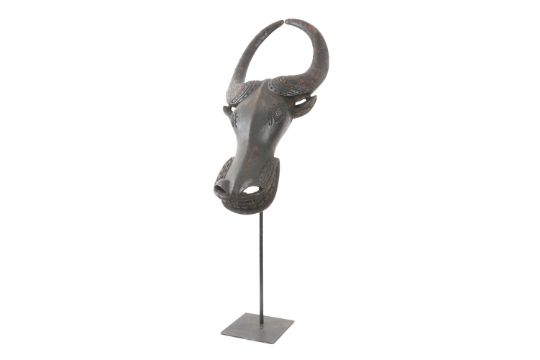 A fine Bamileke people buffalo helmet mask from Cameroon, a significant ...