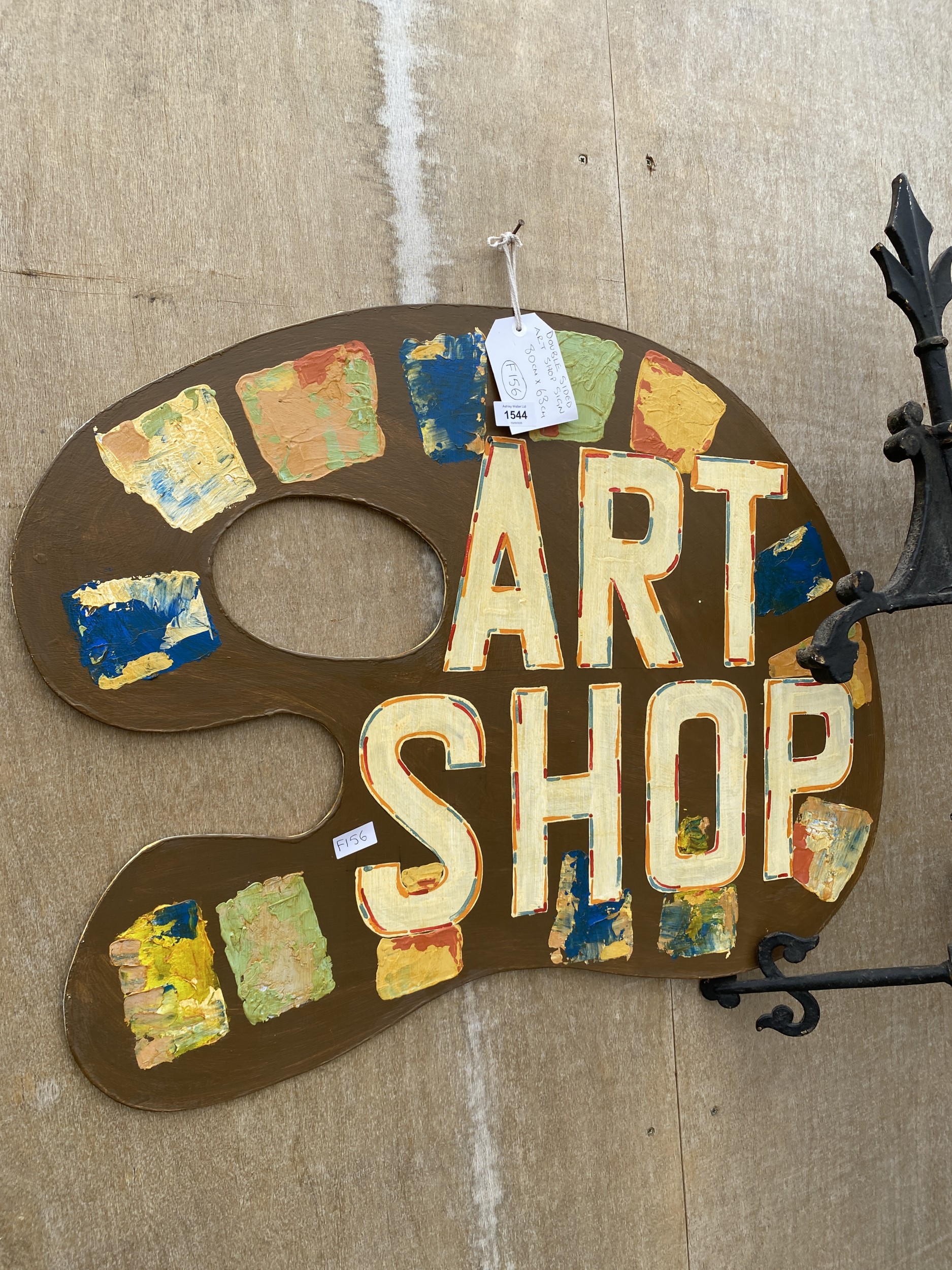 A WOODEN PAINTED DOUBLE SIDED ART SHOP SIGN