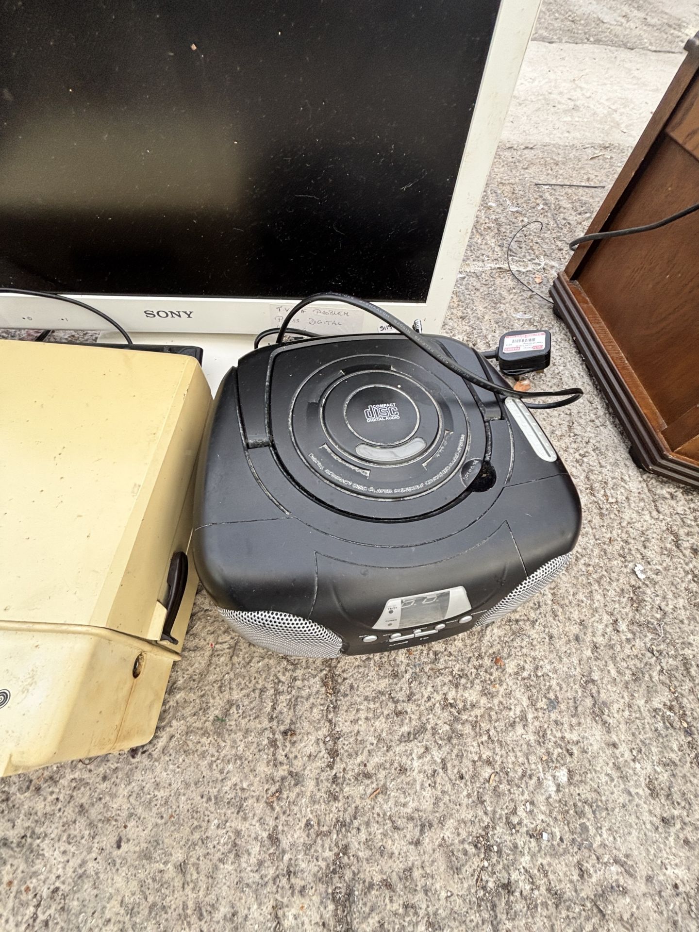 A TELEVISION, CD PLAYER AND SINGER SEWING MACHINE