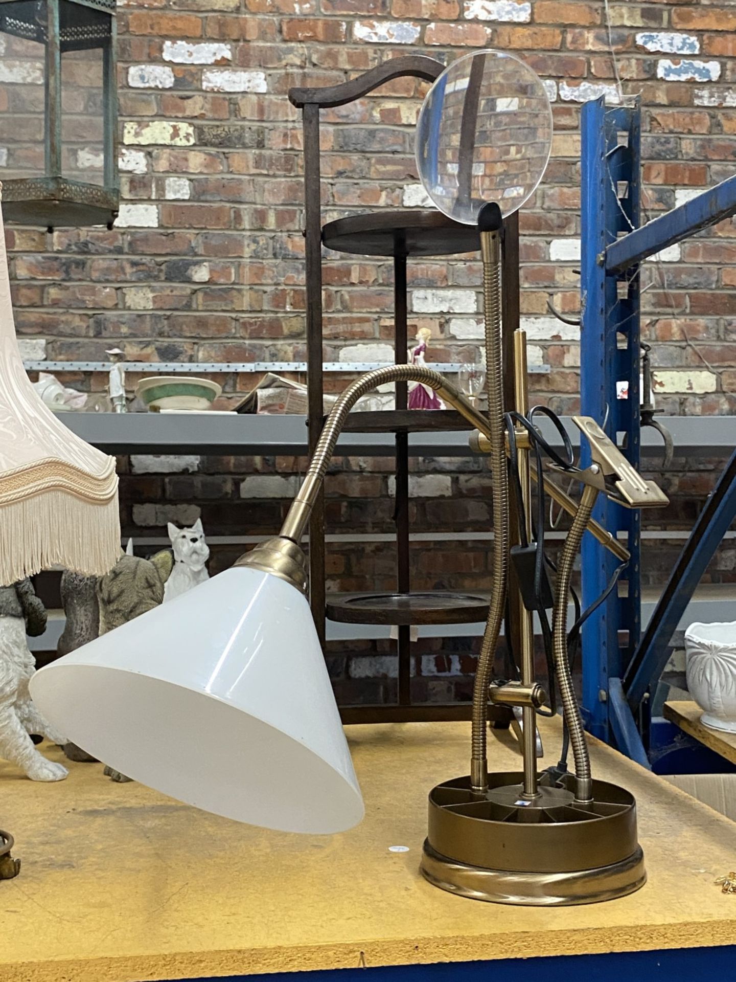 A MULTI-PURPOSE DESK LAMP WITH A MAGNIFYING GLASS AND A CLAMP