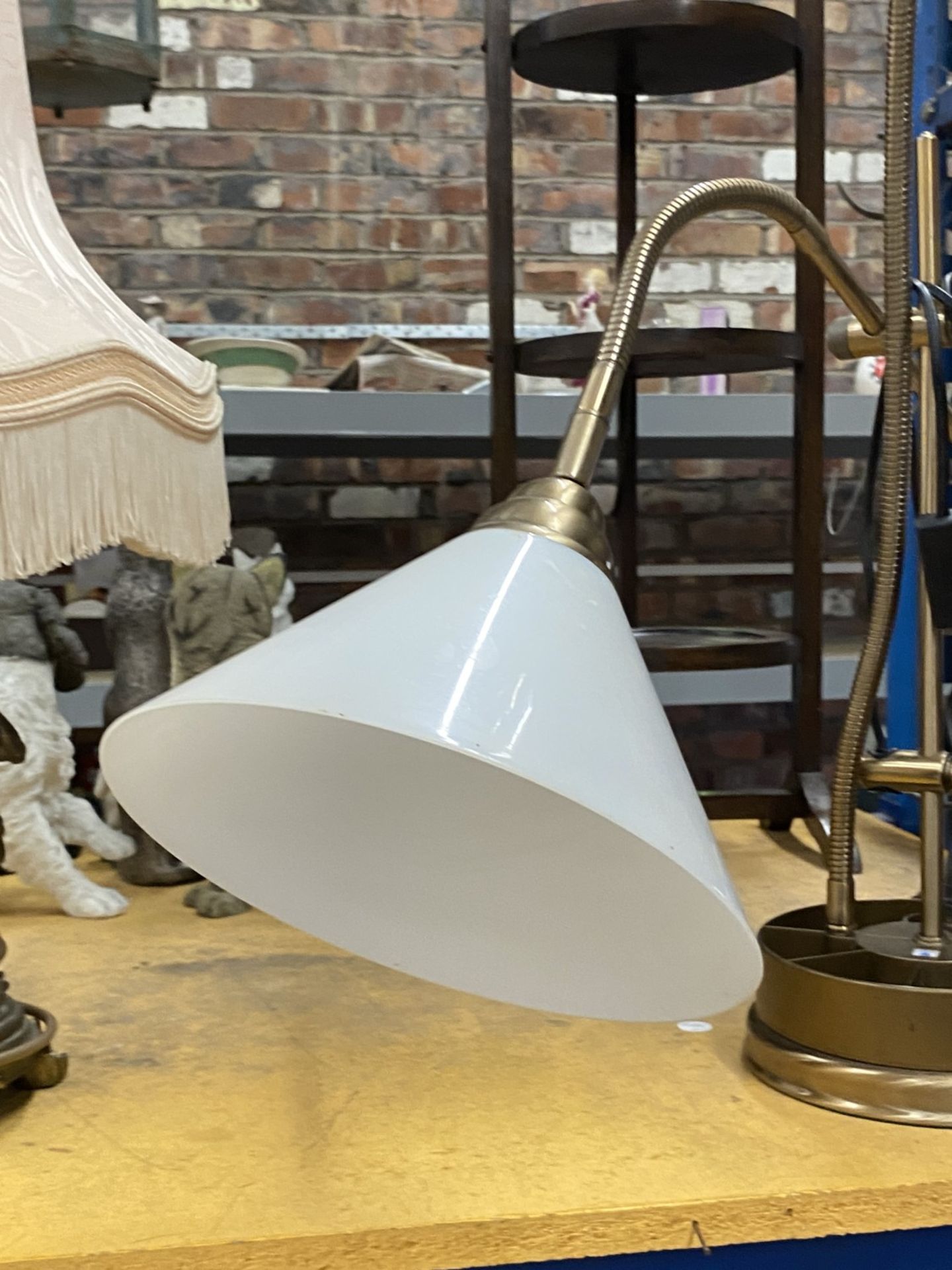 A MULTI-PURPOSE DESK LAMP WITH A MAGNIFYING GLASS AND A CLAMP