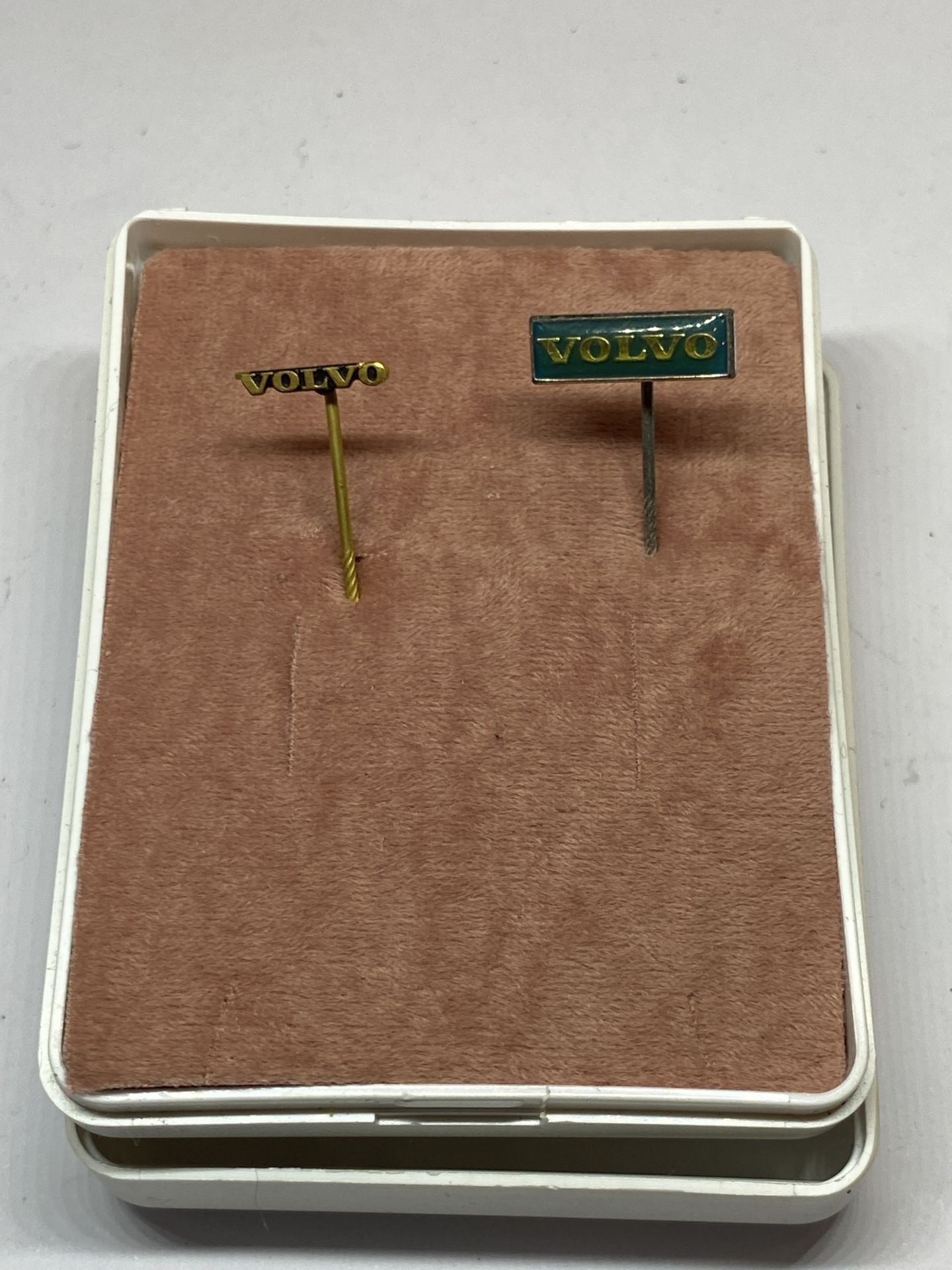 TWO VOLVO PIN BADGES