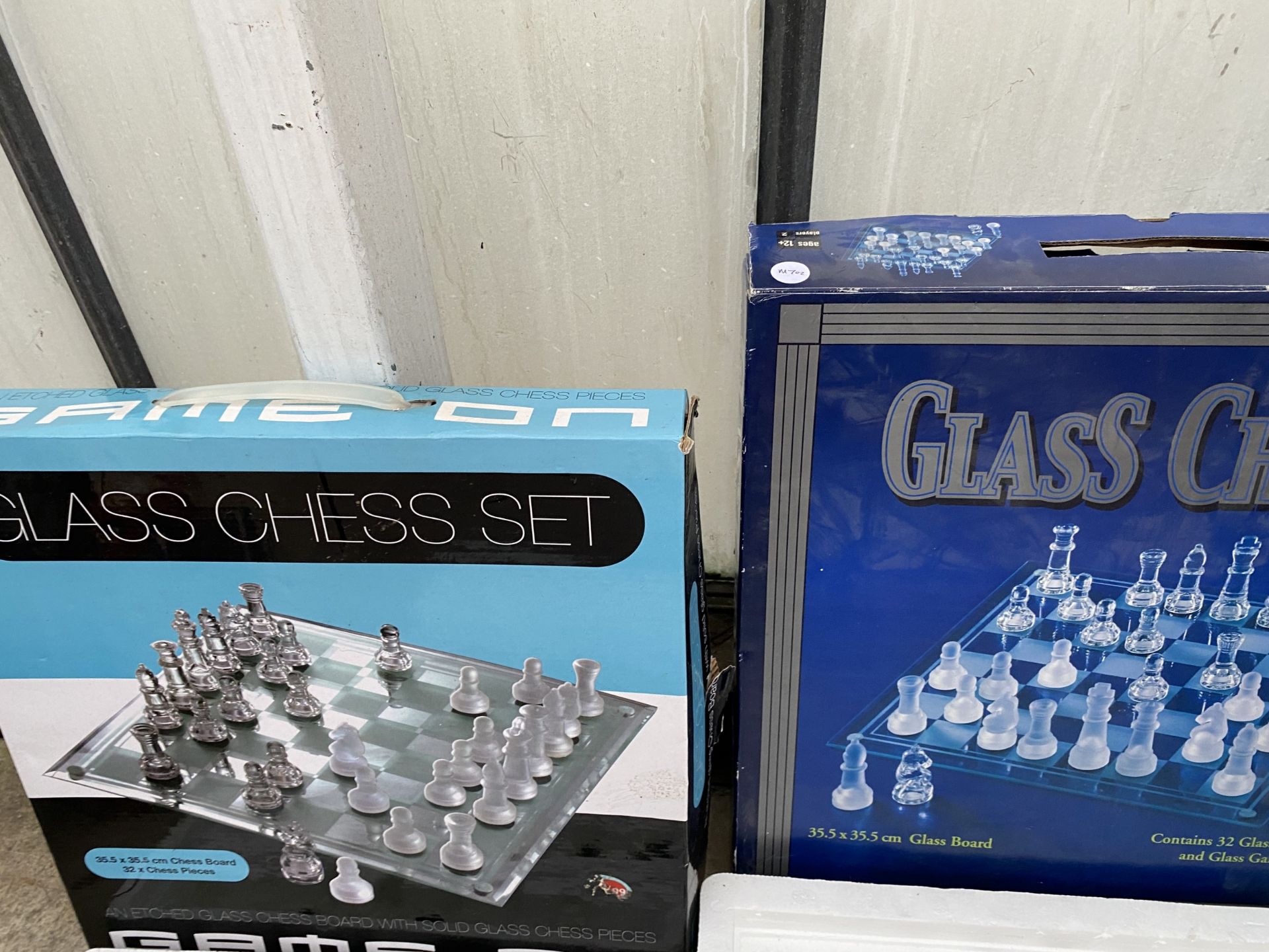 TWO GLASS CHESS SETS