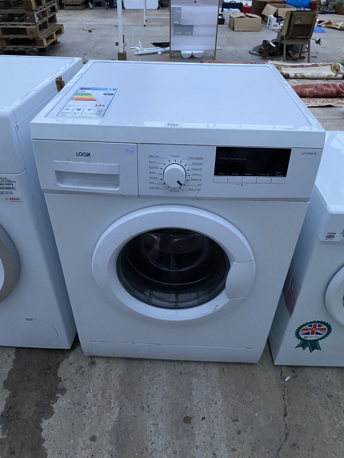 A WHITE LOGIK WASHING MACHINE