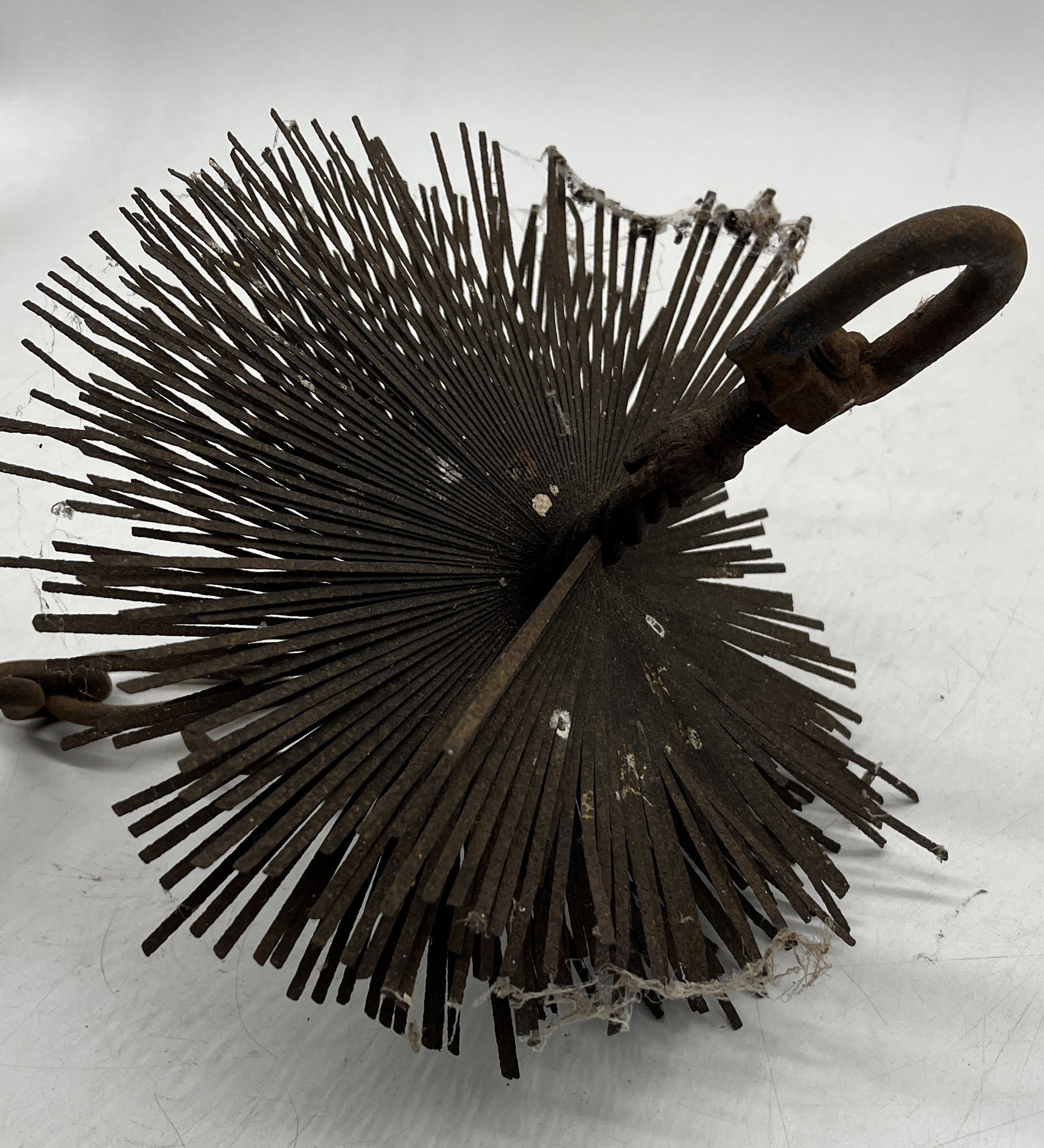 An unusual antique cast iron chimney ball