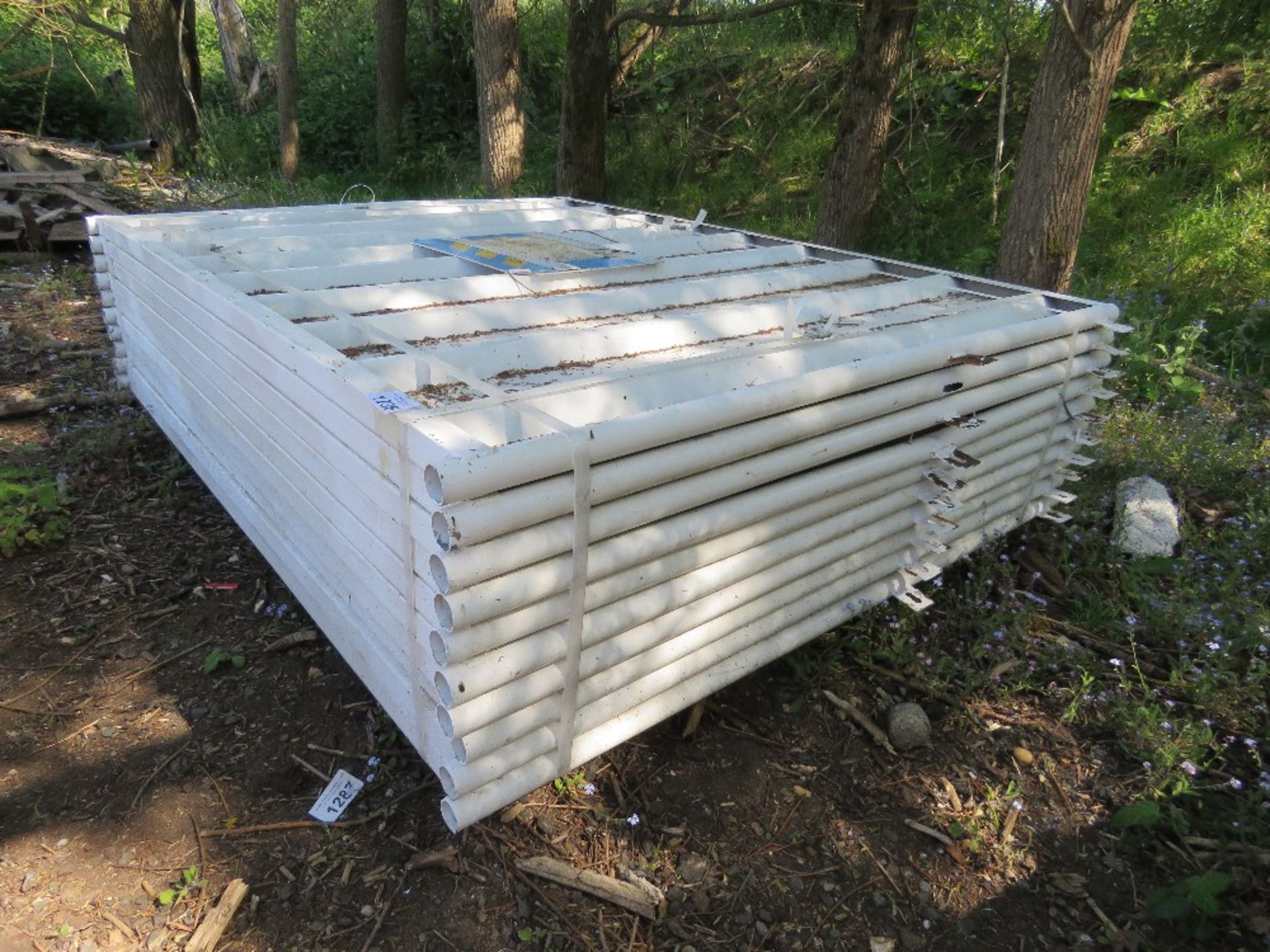 STACK OF SOLID SITE FENCE PANELS