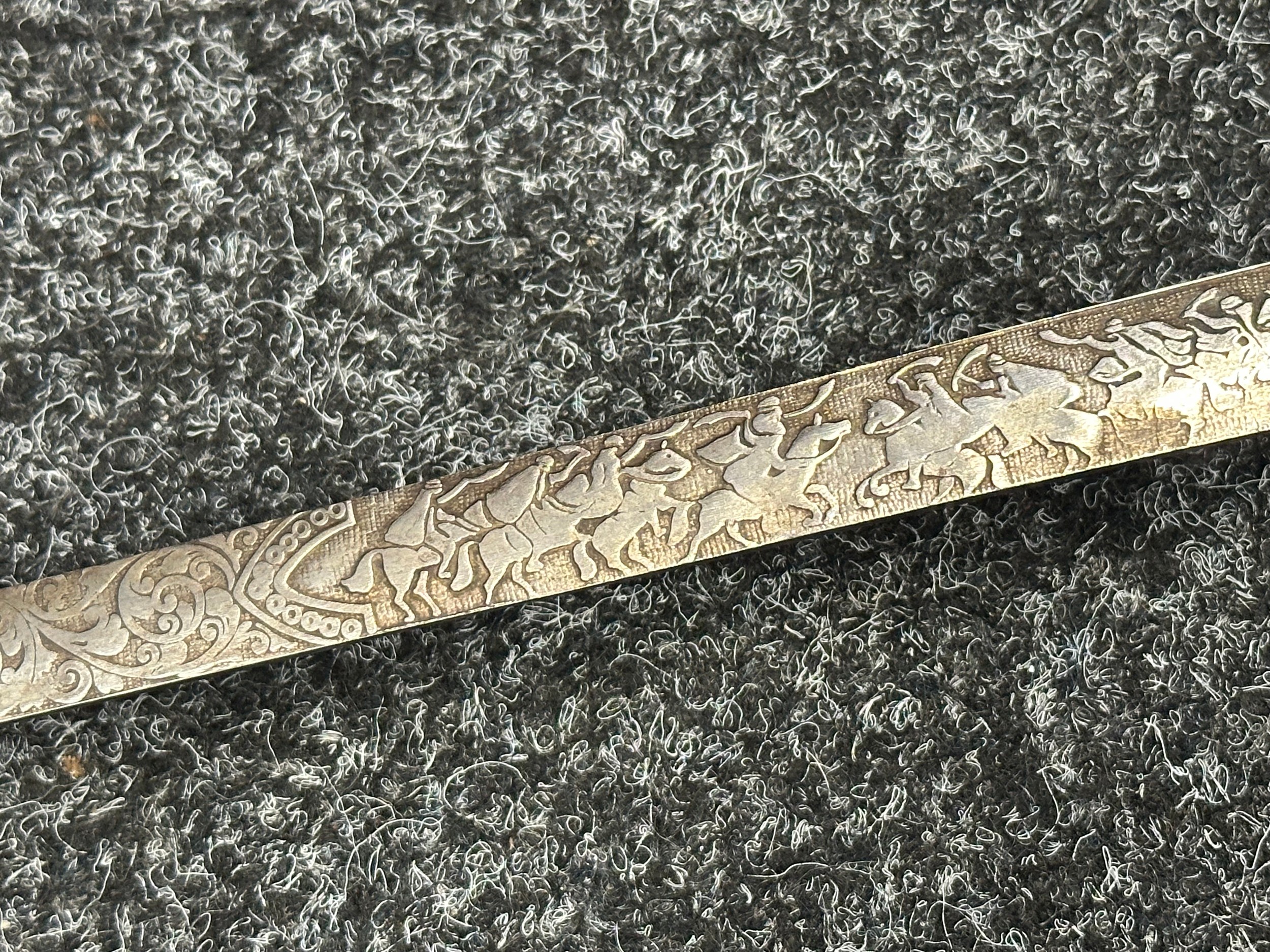 A collection of three Rapiers: One with decorated etched double edged ...