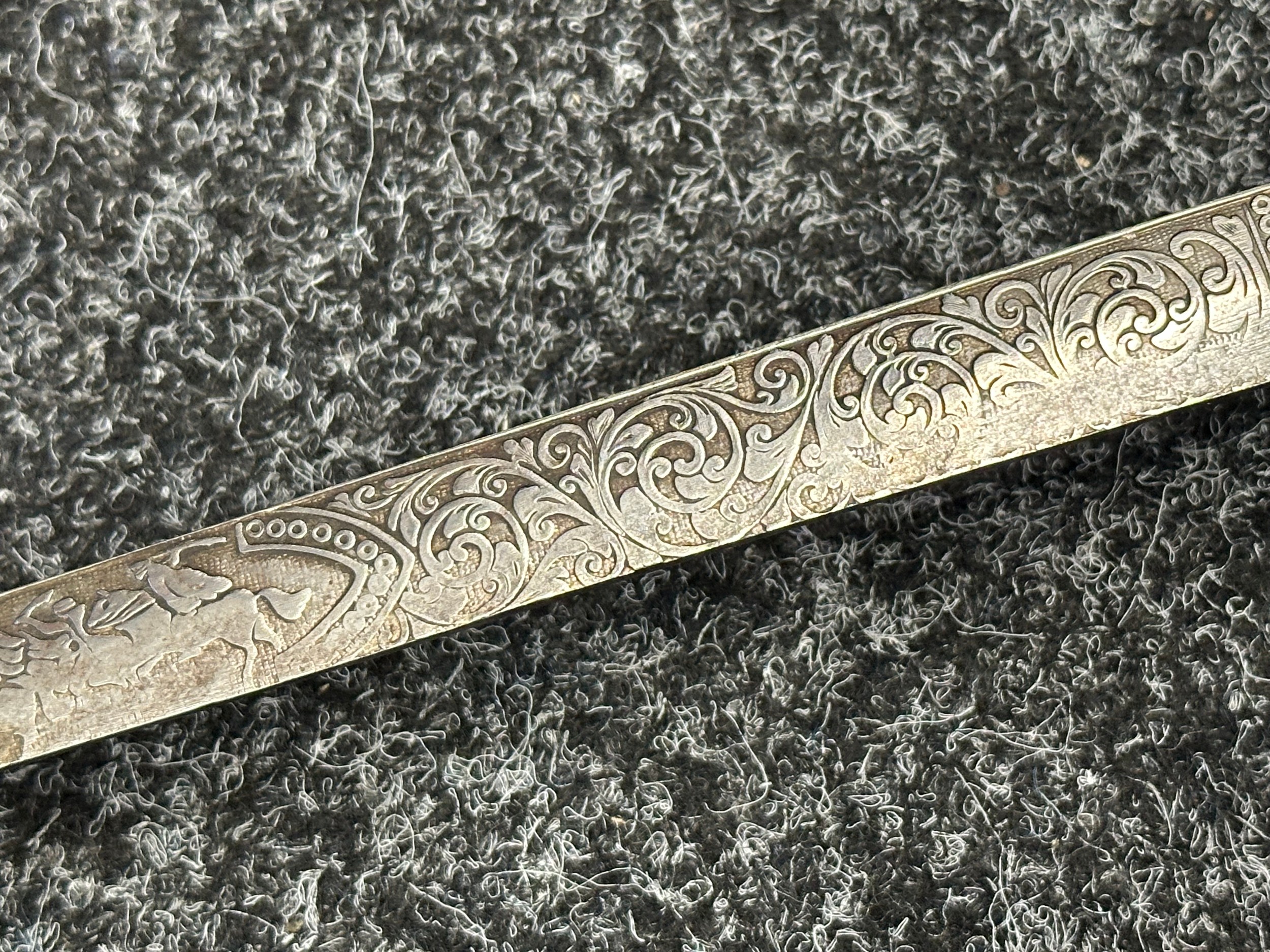 A collection of three Rapiers: One with decorated etched double edged ...