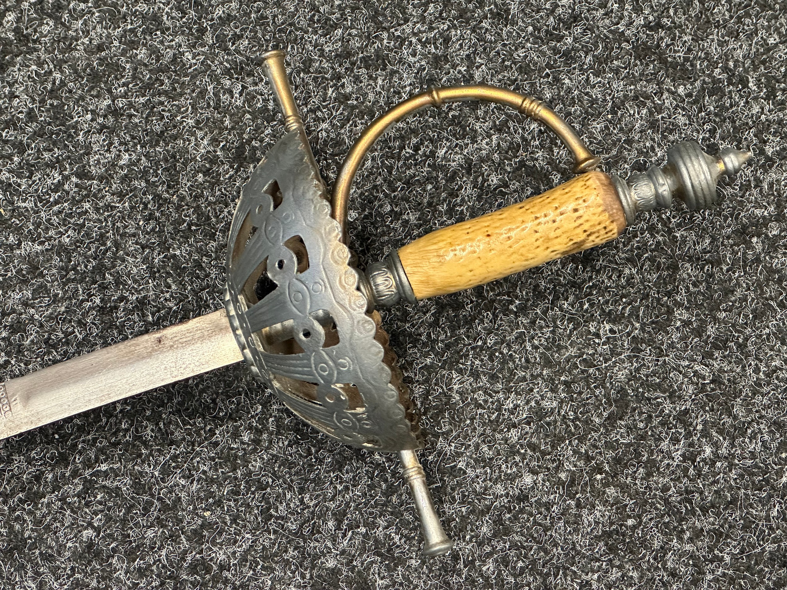 A collection of three Rapiers: One with decorated etched double edged ...