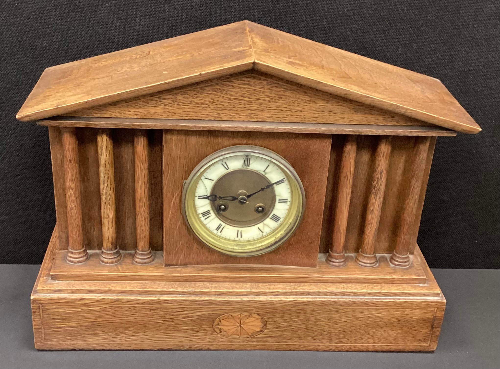 A late Victorian oak mantel clock, architectural pediment, intermitted ...