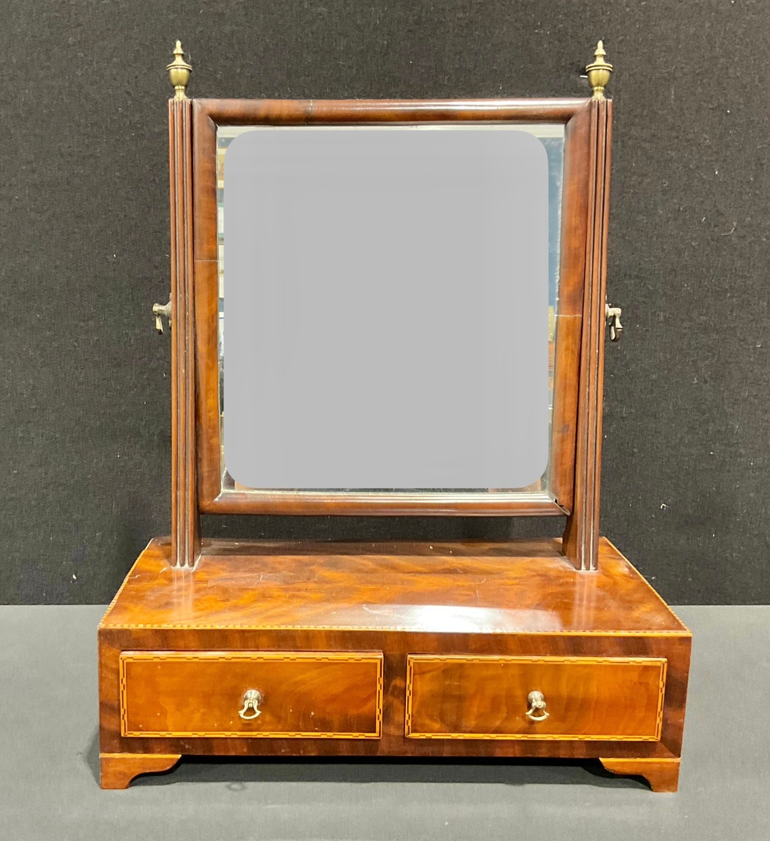A George III flame mahogany inlaid toilet mirror
