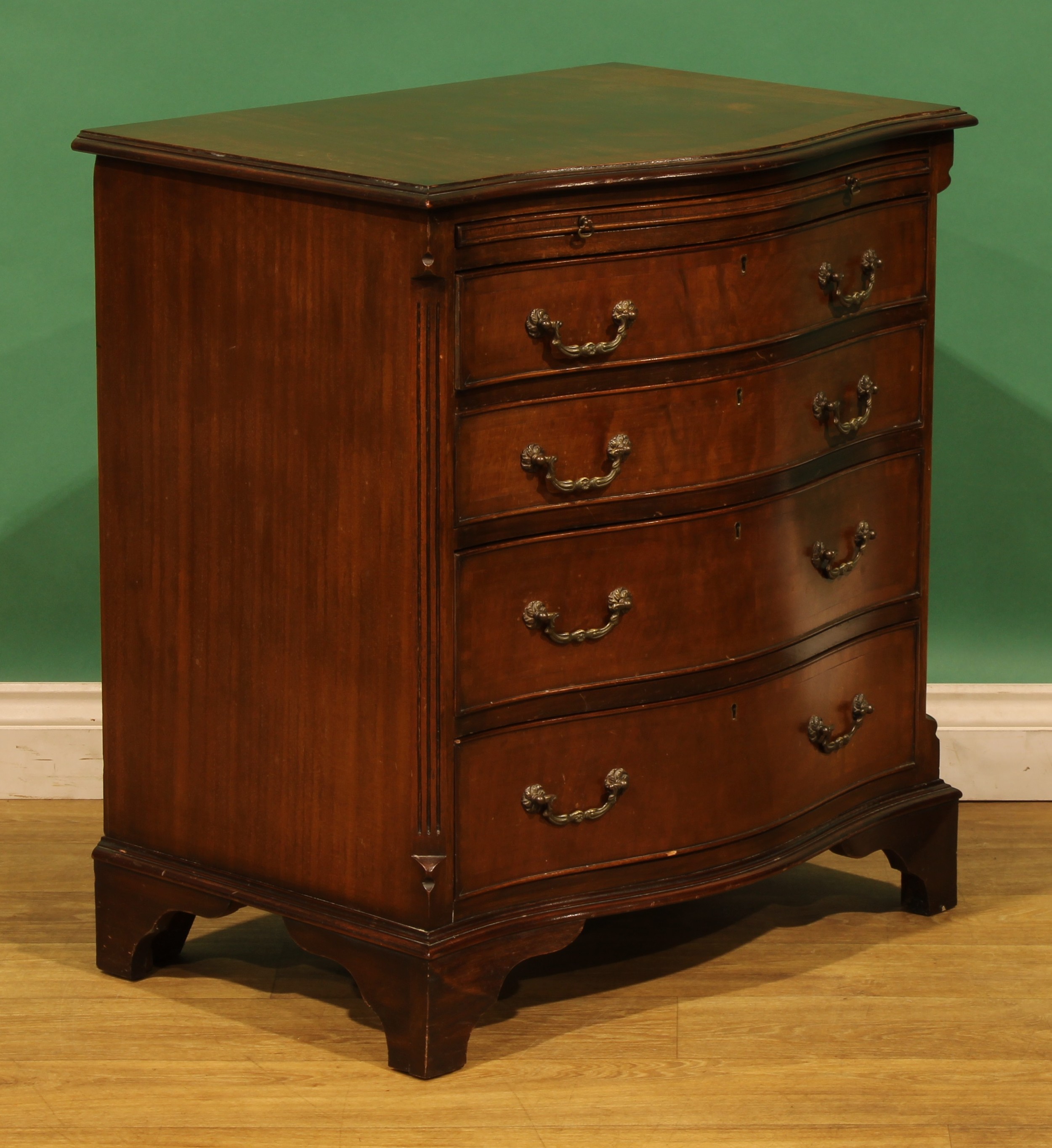A George III style serpentine bachelor’s chest, of small proportions ...