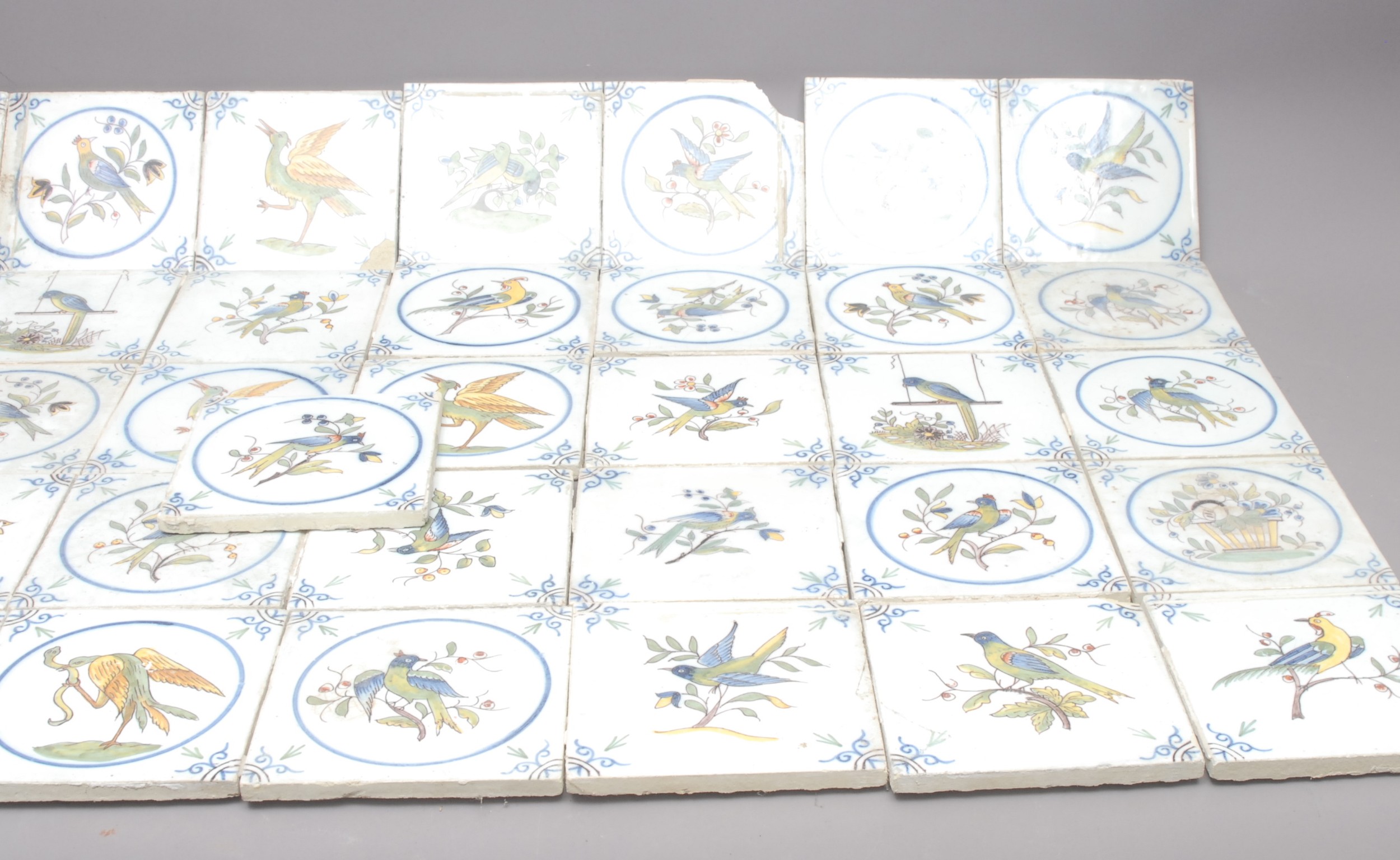A collection of forty one 17th century style Delft ware ceramic tiles ...