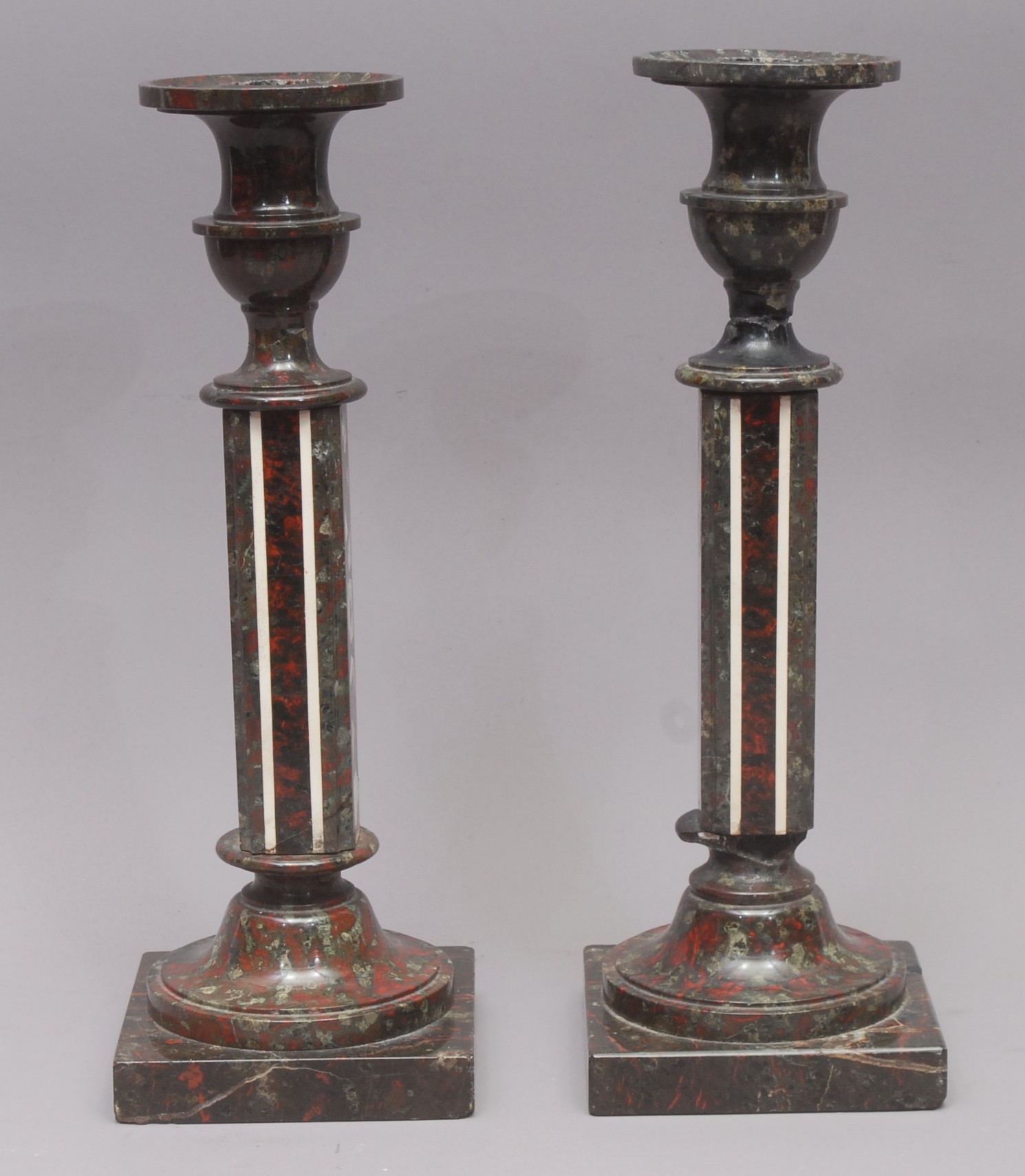 A pair of Cornish serpentine candlesticks, each with a campana sconce ...