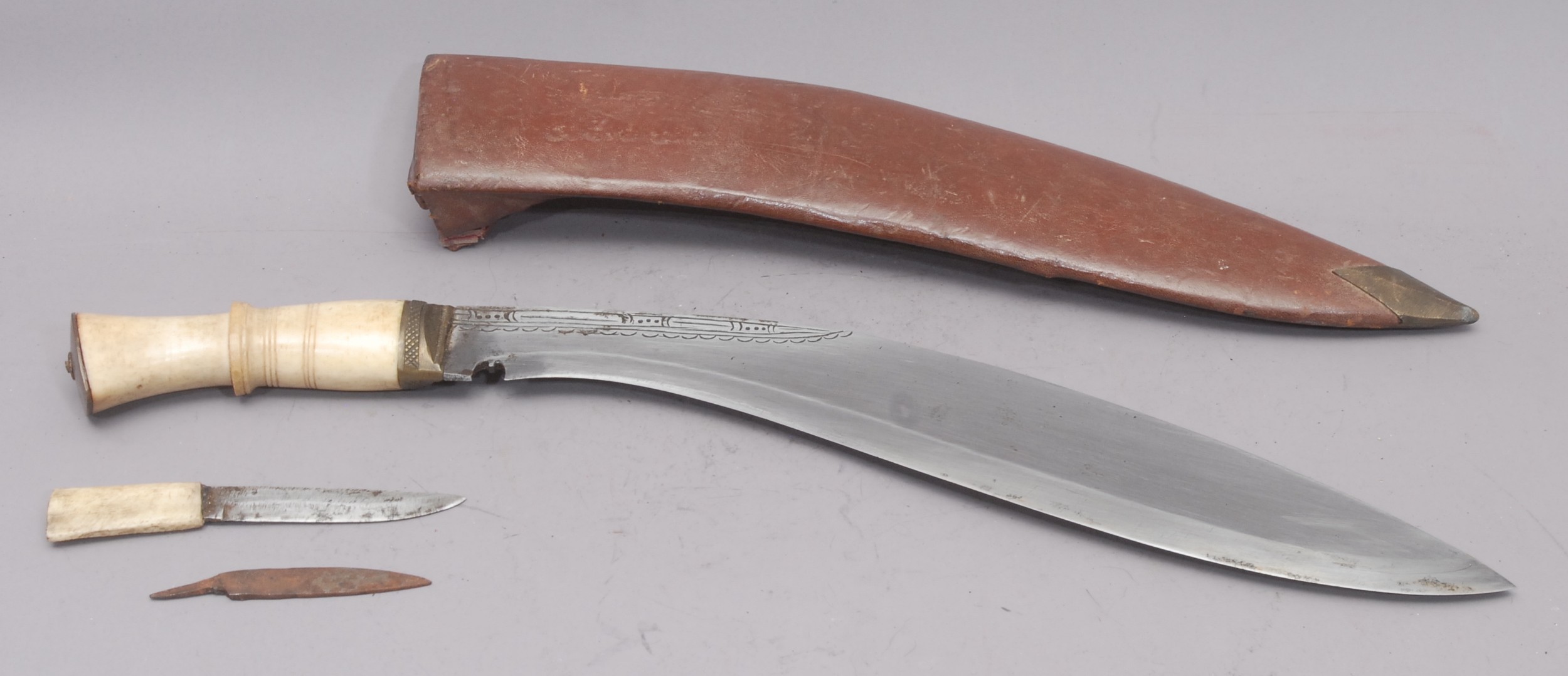 Tribal Art - a Nepalese kukri knife, the blade engraved with floral ...