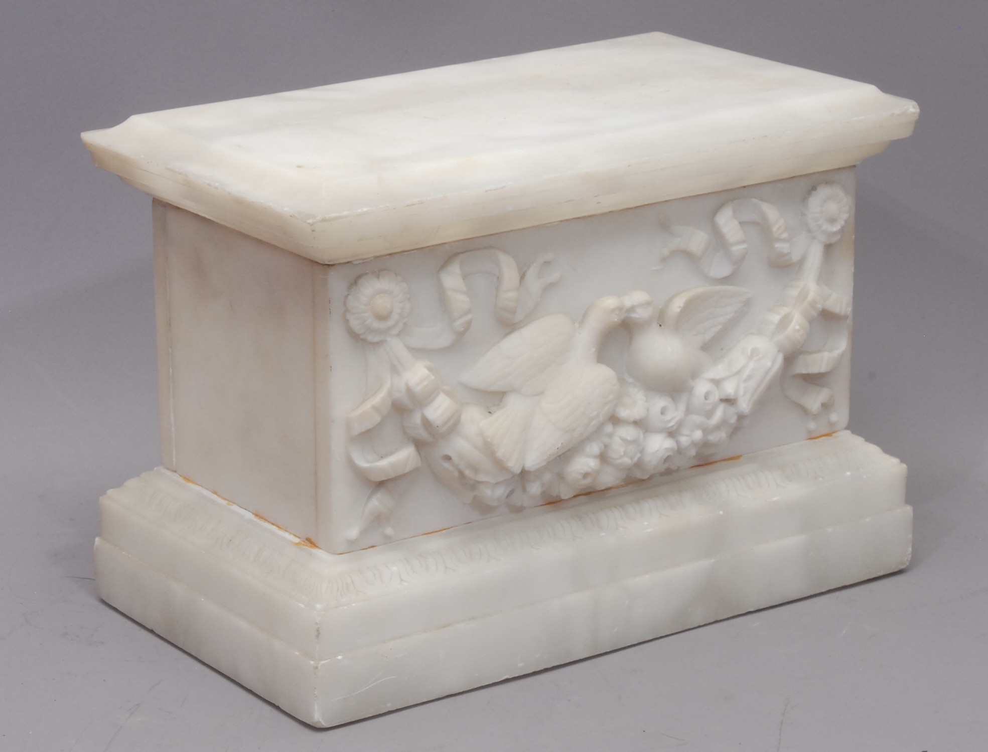 A 19th century Italian alabaster altar shaped statuary plinth, the ...
