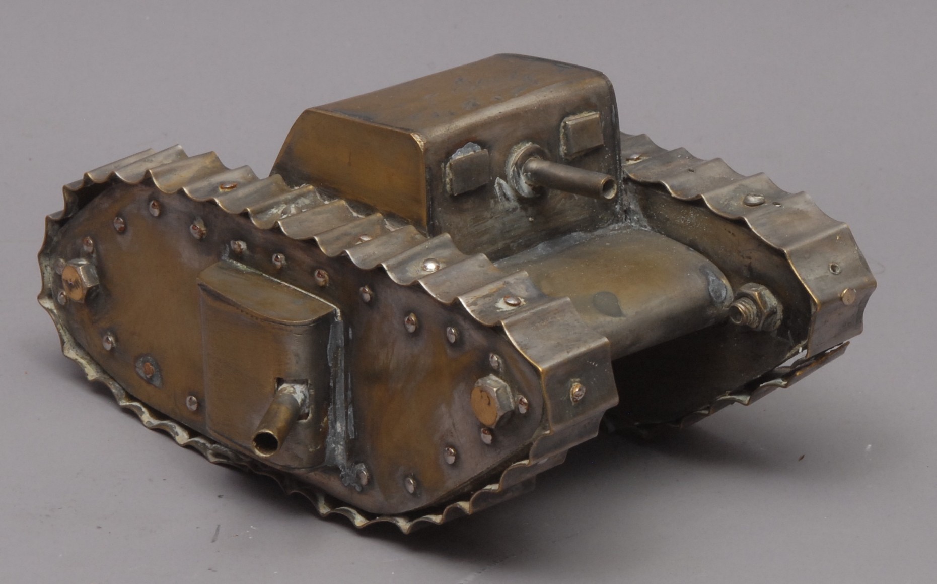 A novelty brass and metal desk weight as a scratch built trench art ...