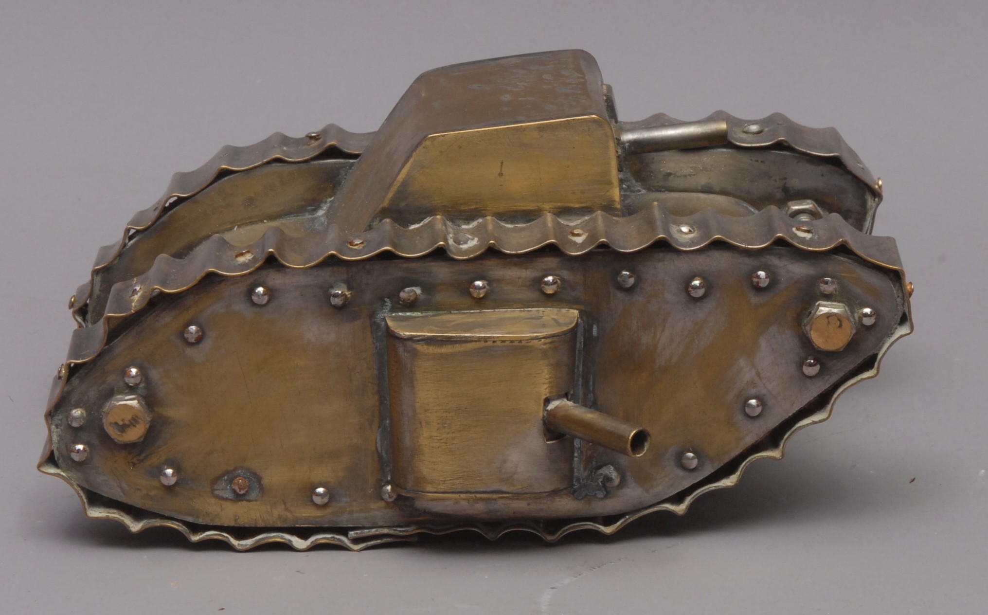 A novelty brass and metal desk weight as a scratch built trench art ...