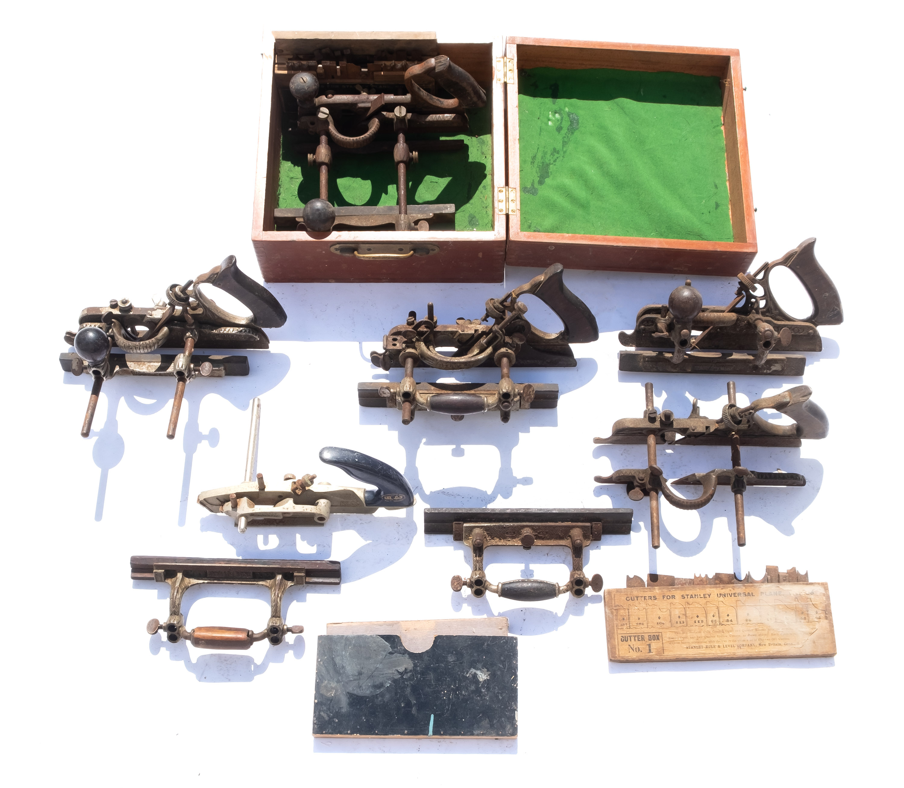 A Stanley 45 combination plane. With a range of blades and in a wooden ...