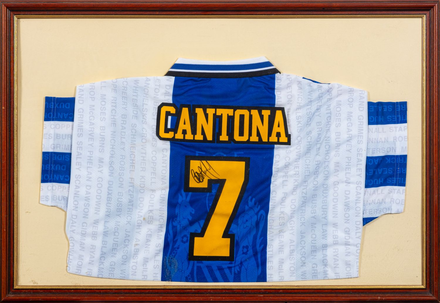 An Eric Cantona signed shirt. In the Manchester Utd away strip with ...