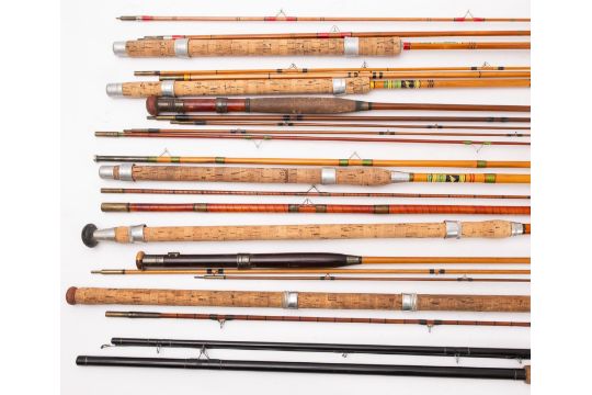 A group of eight various fishing rods, comprising and Army & Navy 9ft ...