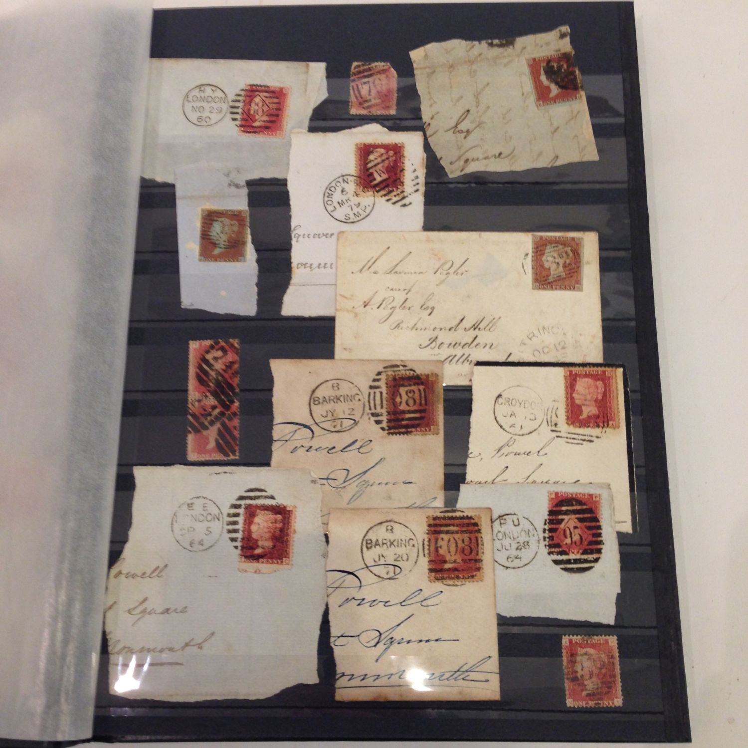 A collection of stamps and postal history covers in a green stock book ...