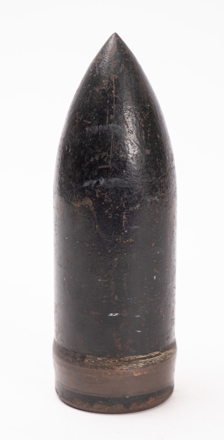 An early 20th Century artillery shell. With stamps to base, 23cm high.