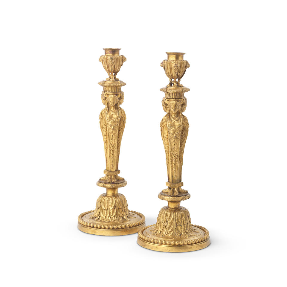 A pair of French gilt bronze candlesticks After designs by Francois ...