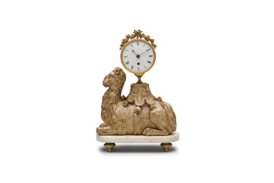 An unusual gilt wood figural clock in the form of a seated camel Young ...