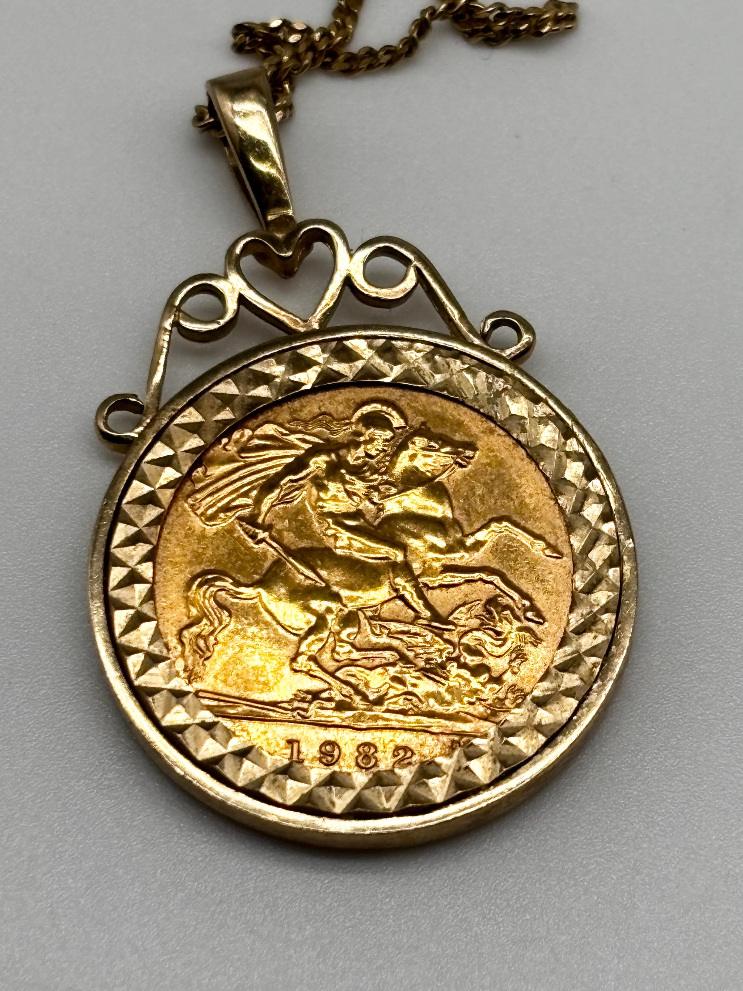 22ct Gold 1982 Half Sovereign within a 9ct Gold Pendant and Chain ...