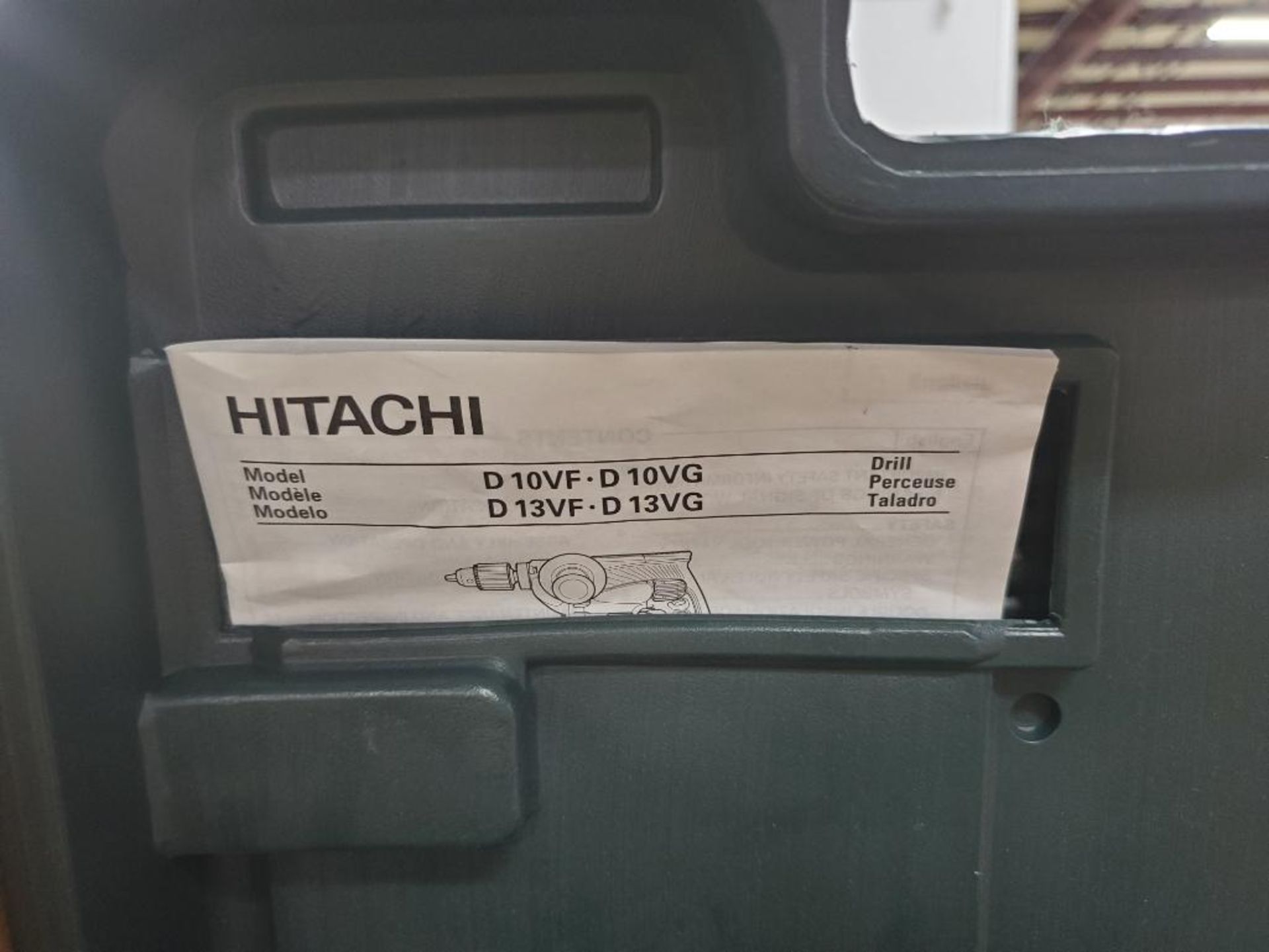 Hitachi drill with case.