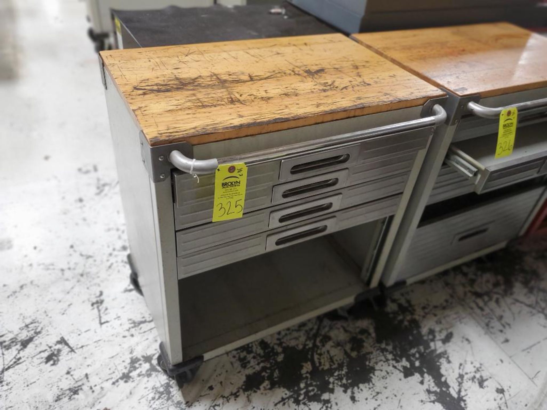 4 drawer roll around cart. Wood top. 28in width.