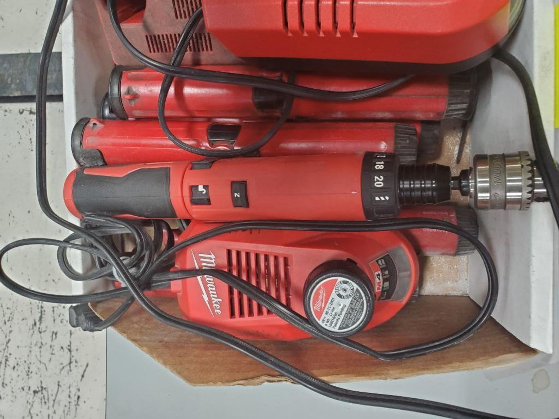 Assorted Milwaukee tools.