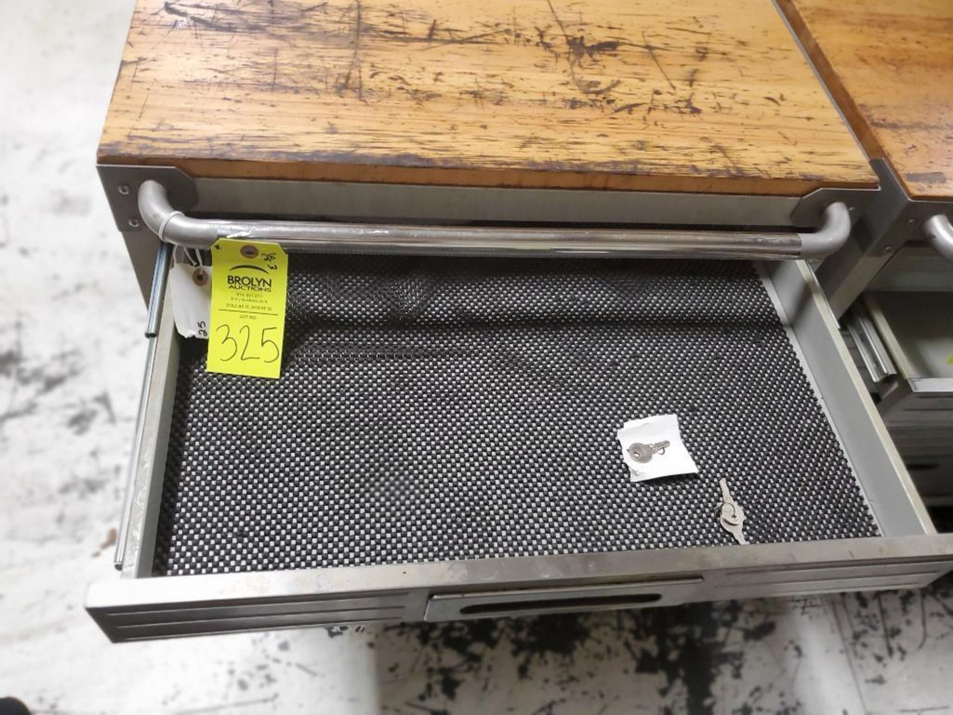 4 drawer roll around cart. Wood top. 28in width.