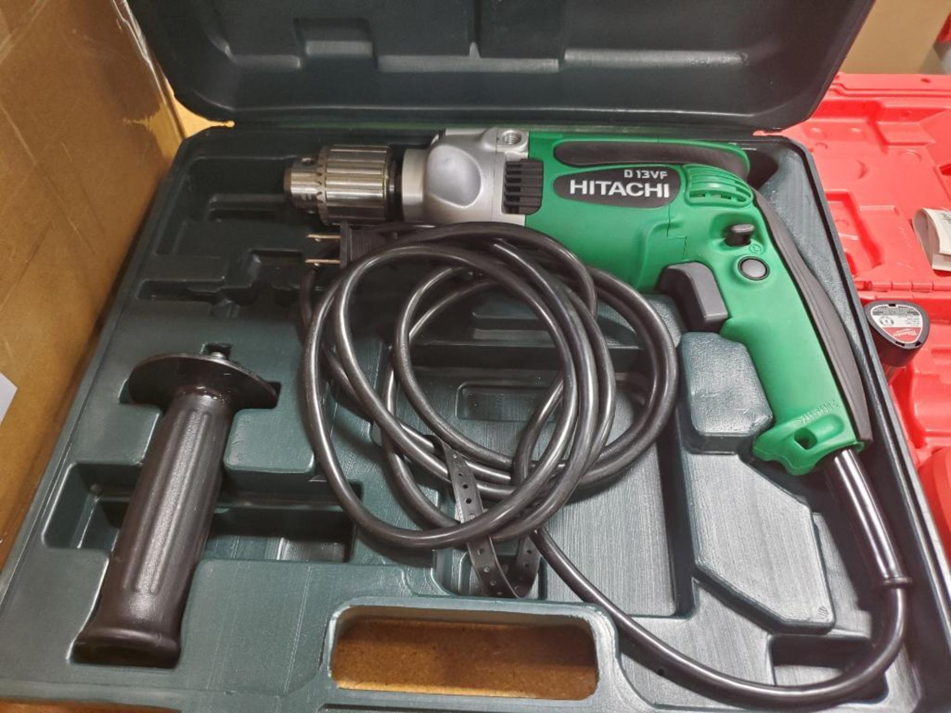Hitachi drill with case.