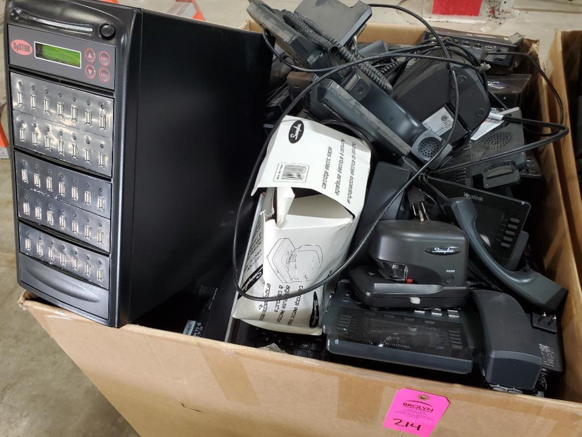 Box of assorted computers peripherals.
