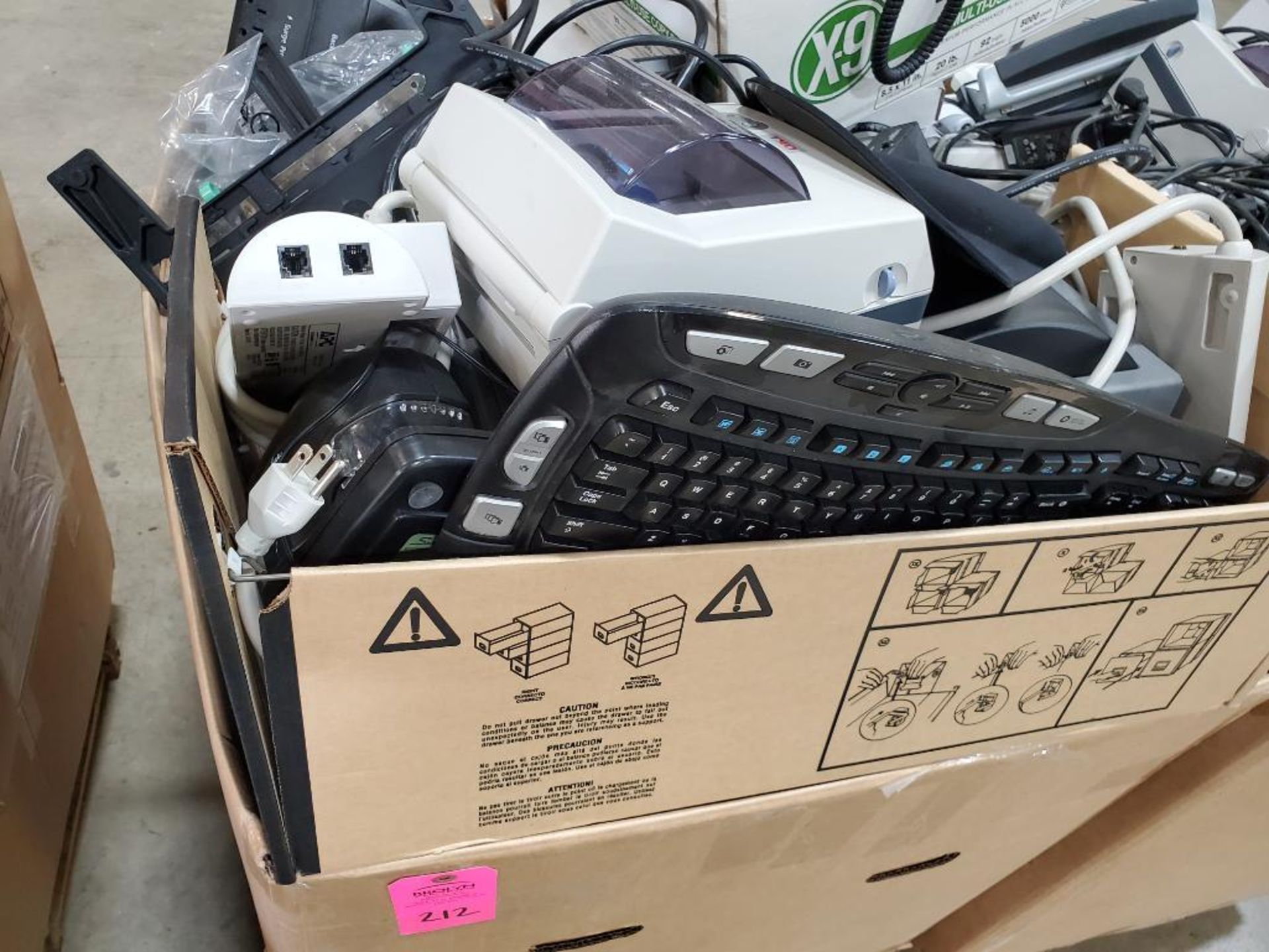 Box of assorted computers peripherals.